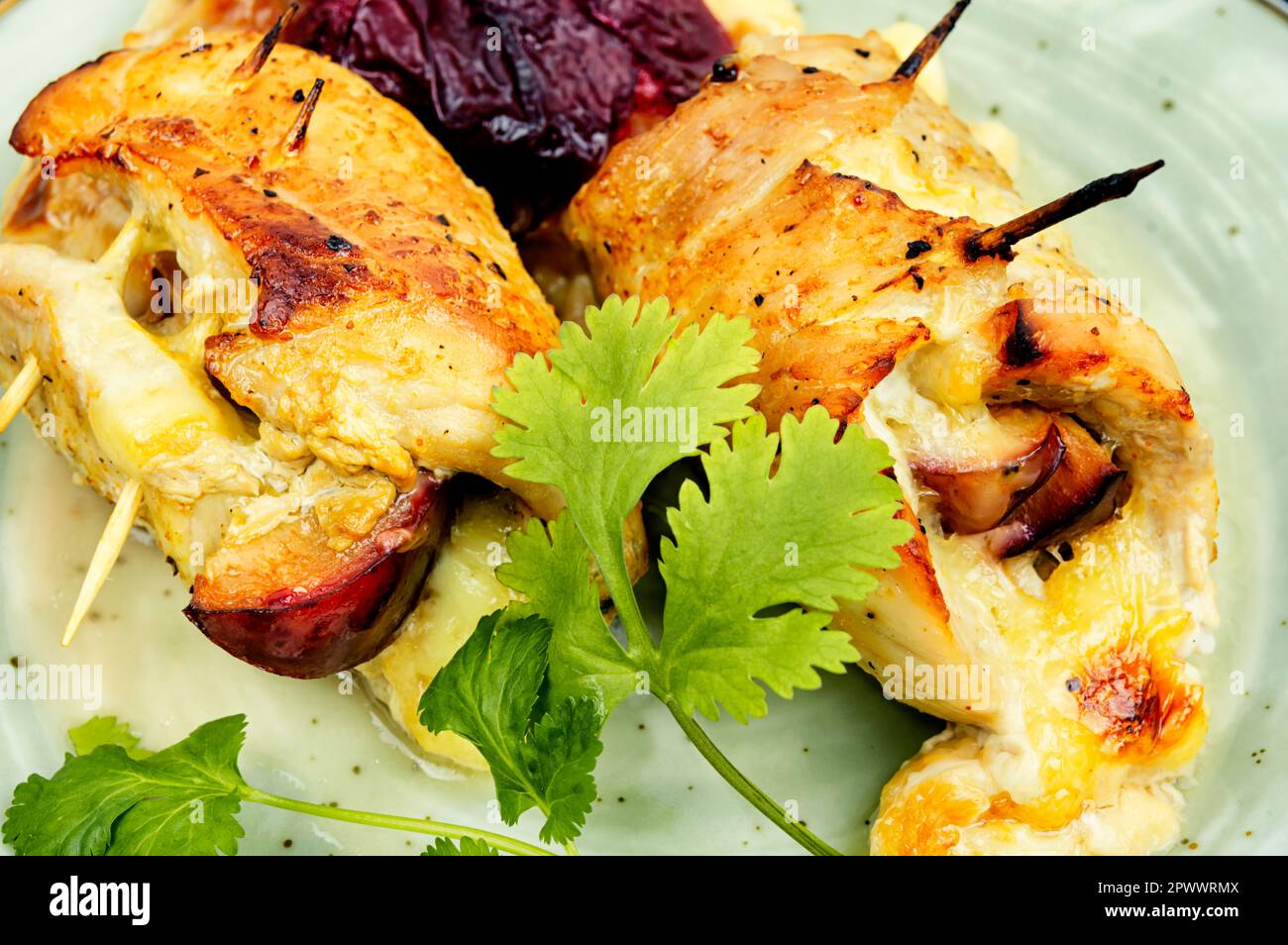 Delicious grilled meat rolls stuffed plums Stock Photo - Alamy