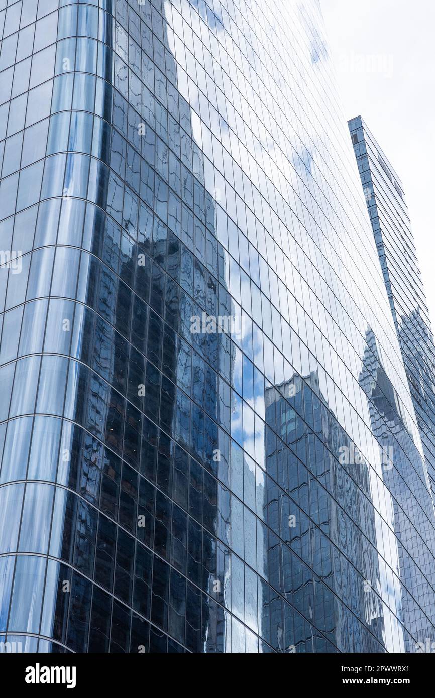 New glass-sided building in midtown Manhattan reflects the image of ...