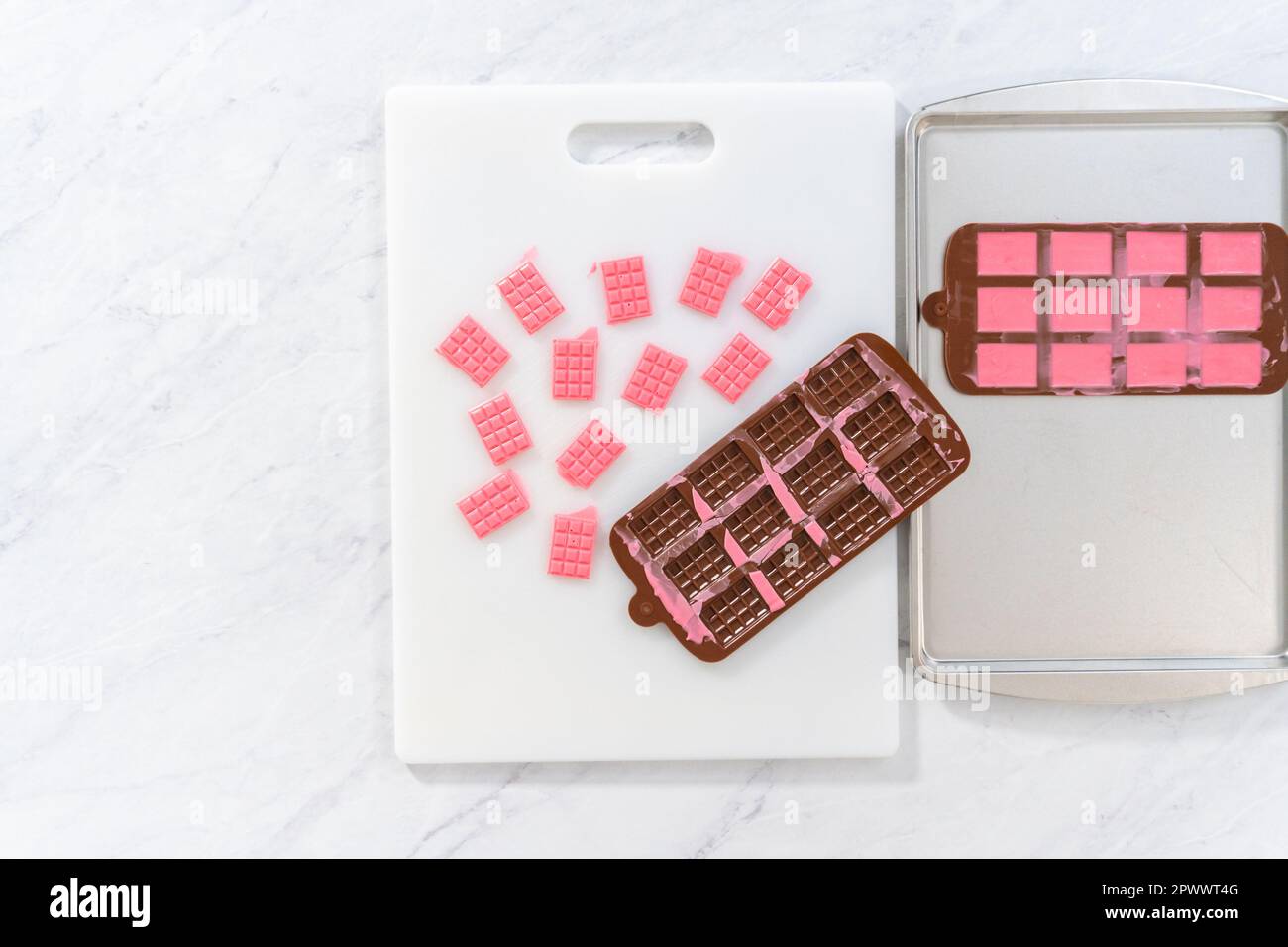 Mini pink chocolates Stock Photo - Alamy