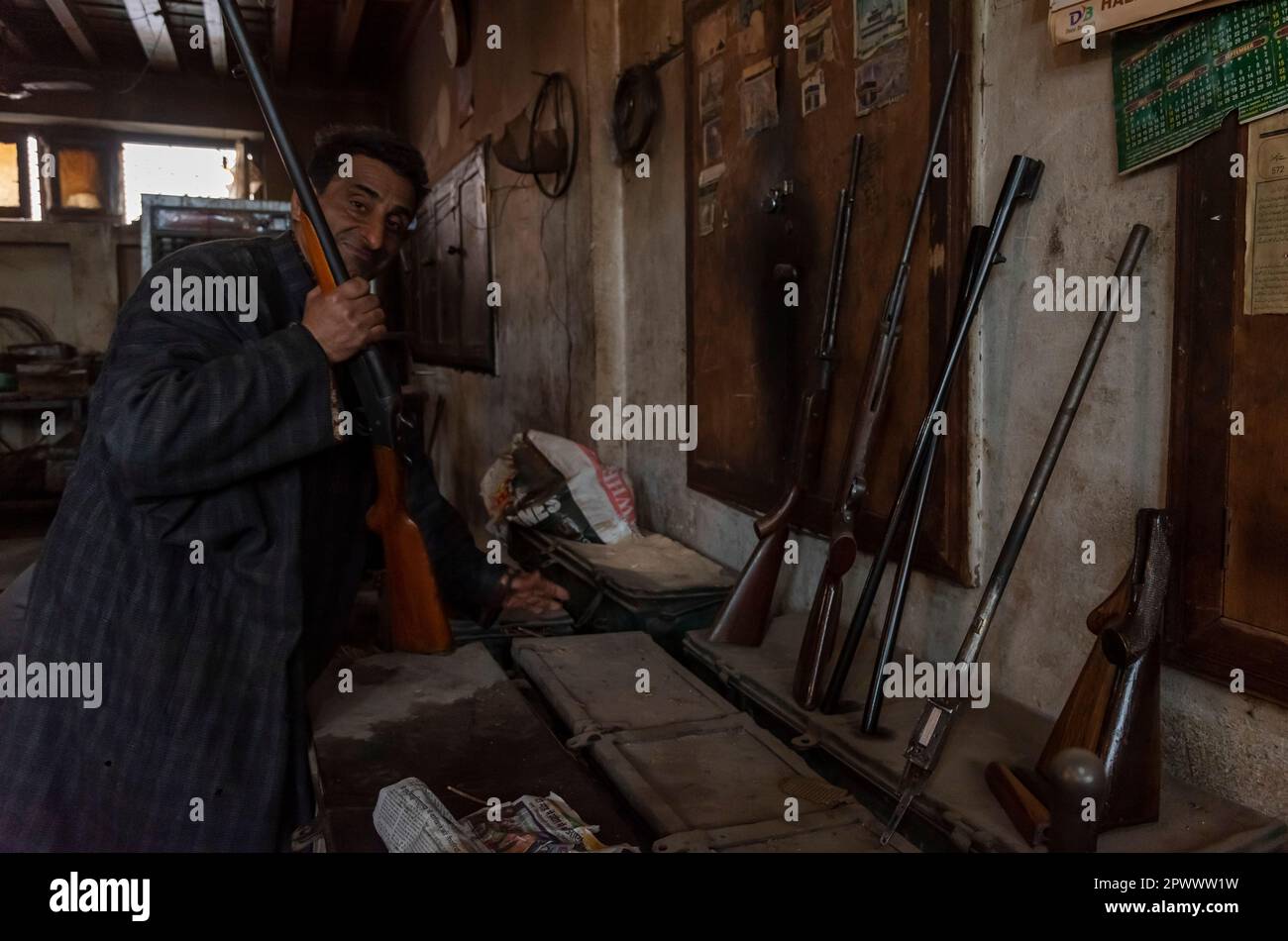 Srinagar, India. 01st May, 2023. A labourer looks on as he hold a ...