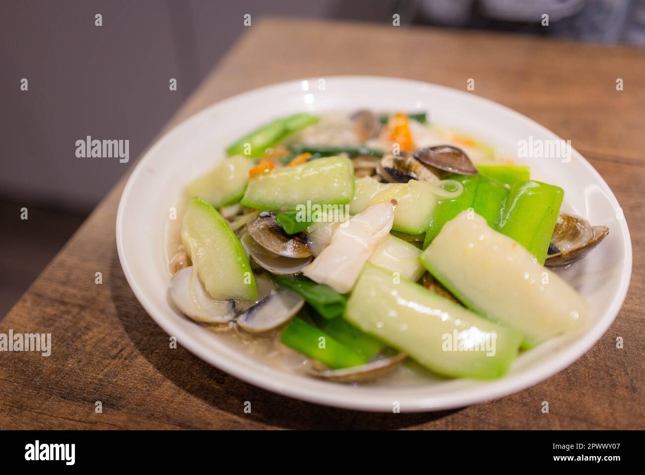 Fried Loofah gourd with Clam Stock Photo - Alamy