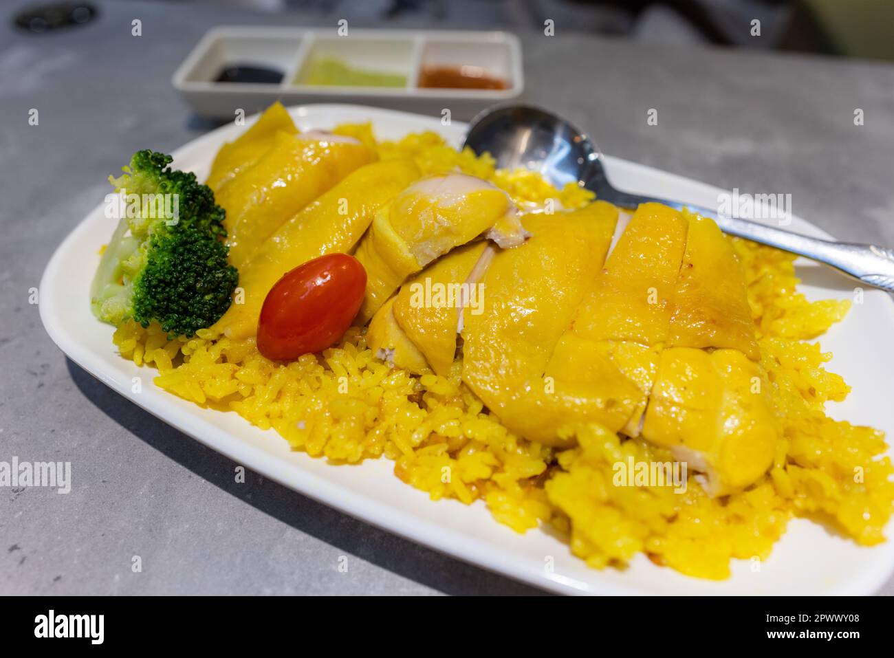 Hainanese chicken rice dish in restaurant Stock Photo - Alamy