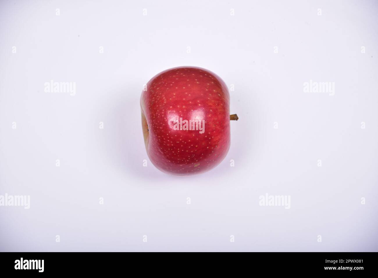 red apple side view on an isolated background Stock Photo - Alamy