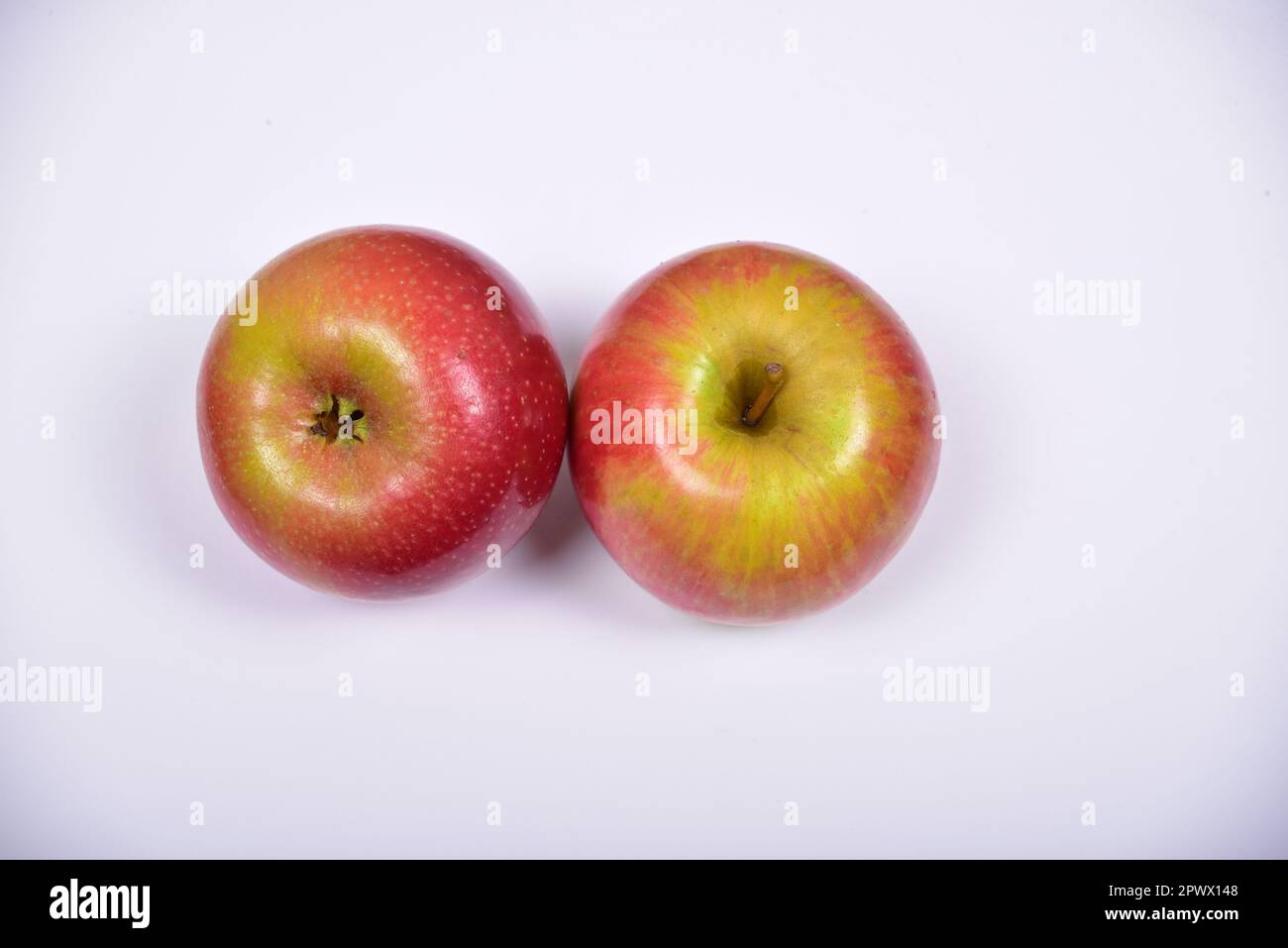 pair of red apples top view on a white background Stock Photo - Alamy