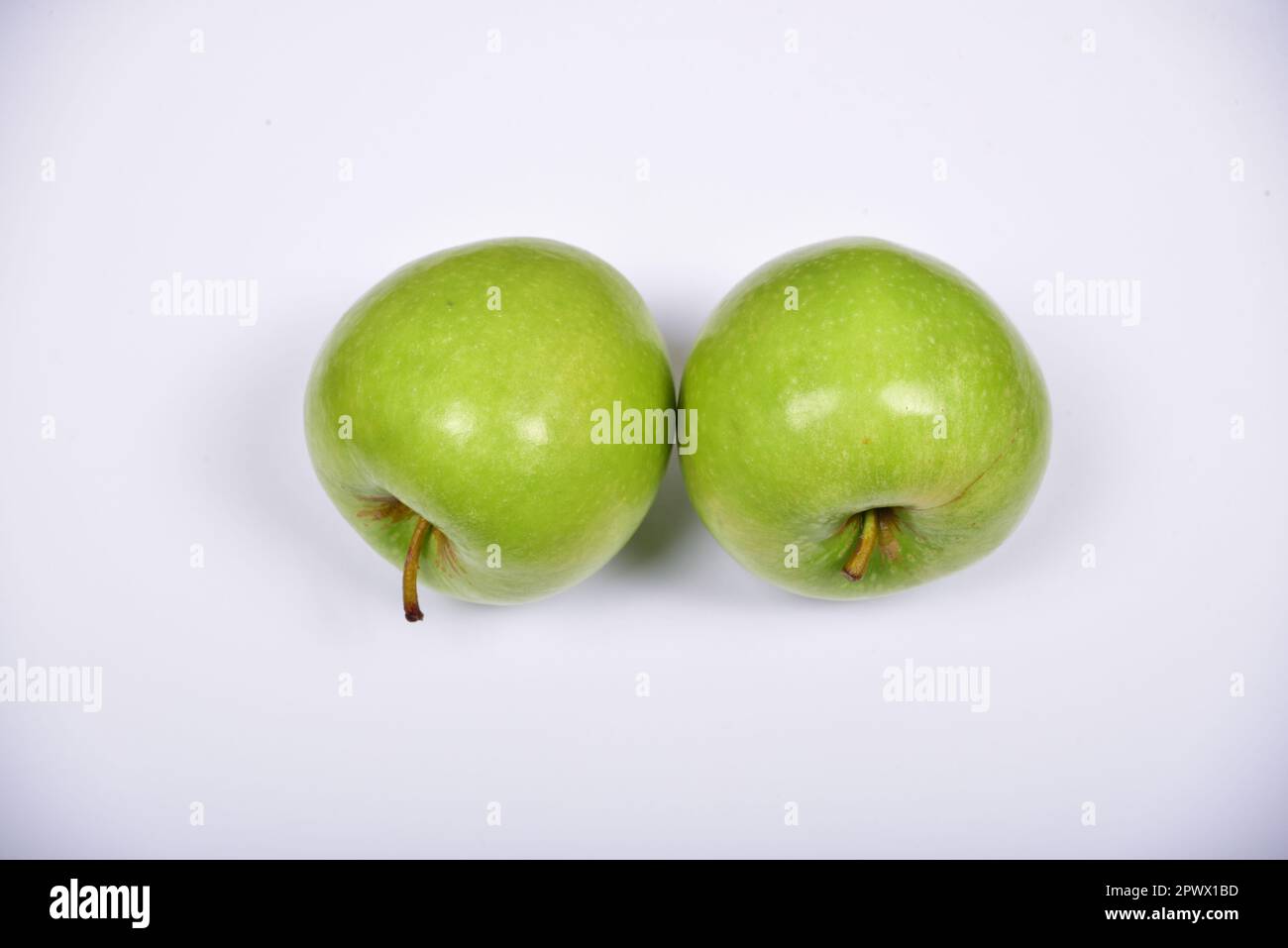 Green apples side view on an isolated backrground Stock Photo - Alamy