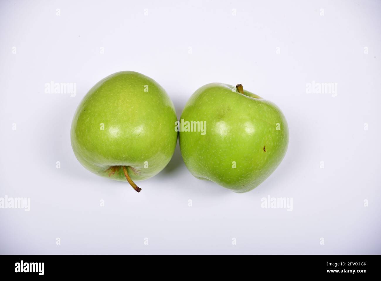 Green apples side view on an isolated backrground Stock Photo - Alamy