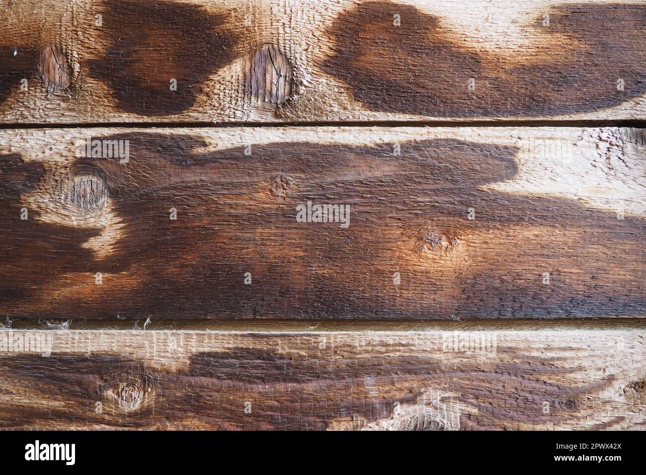 Burnt scorched horizontal boards background. Wooden background close-up ...