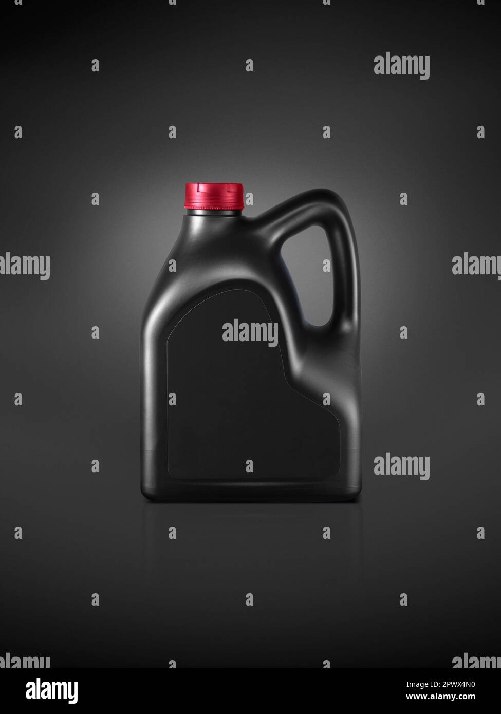 Gallon of engine oil on a dark black background Stock Photo - Alamy
