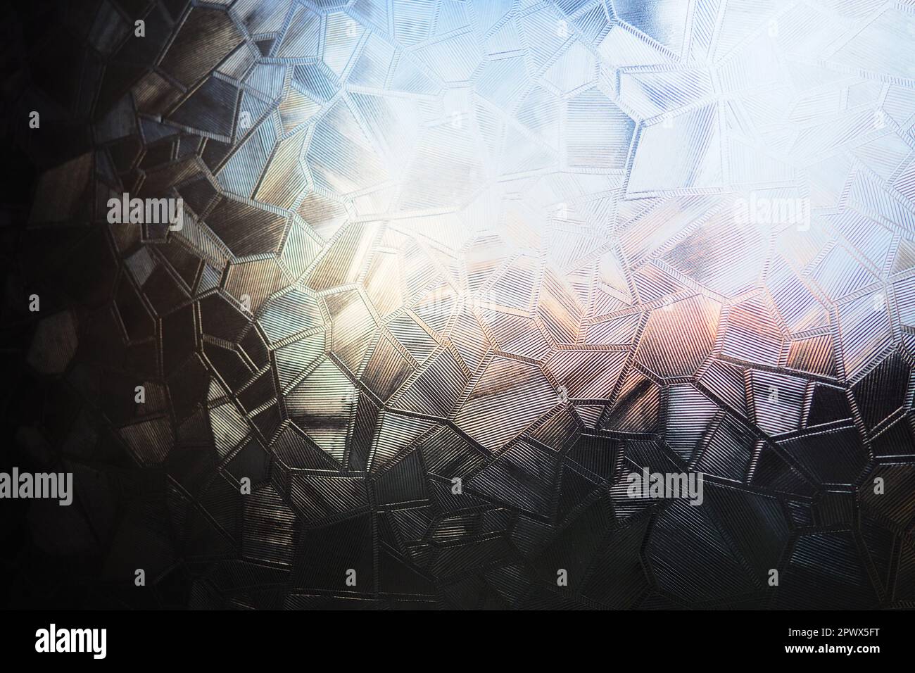 Fluted glass with backlight. Beautiful multicolored refraction of light ...