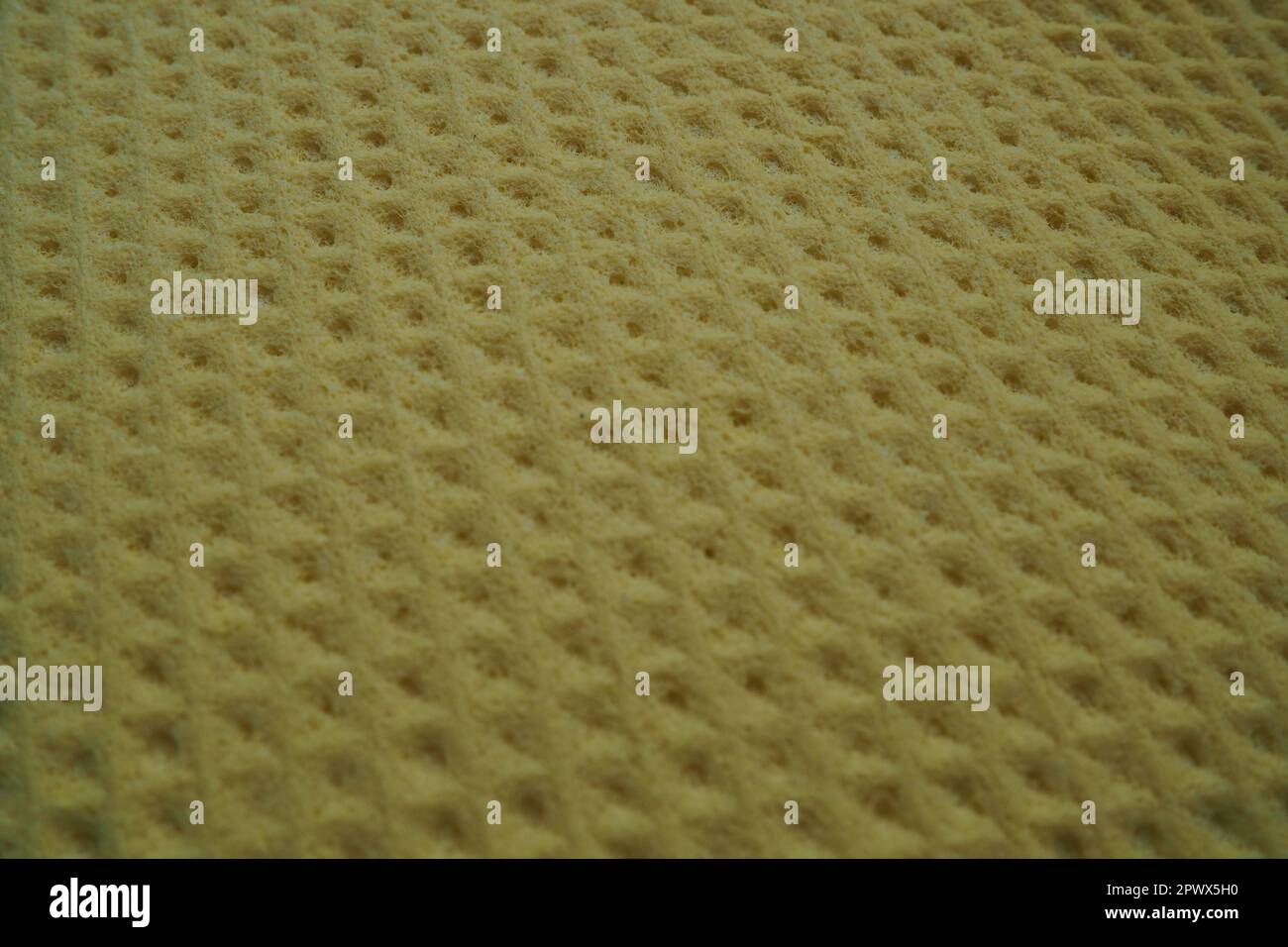 Sponge fibers sponge texture pattern surface close-up yellow brown ...