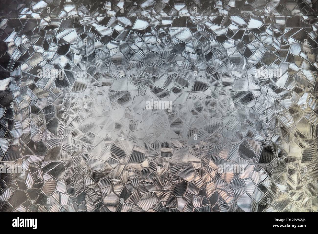 Fluted glass with backlight. Beautiful multicolored refraction of light ...