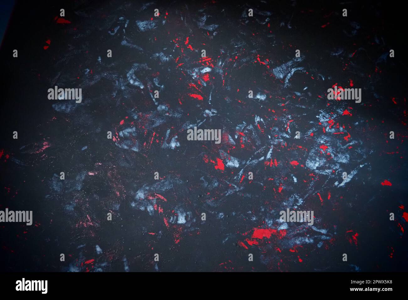 Black background with red, white, gray and blue strokes, dashes, stains ...