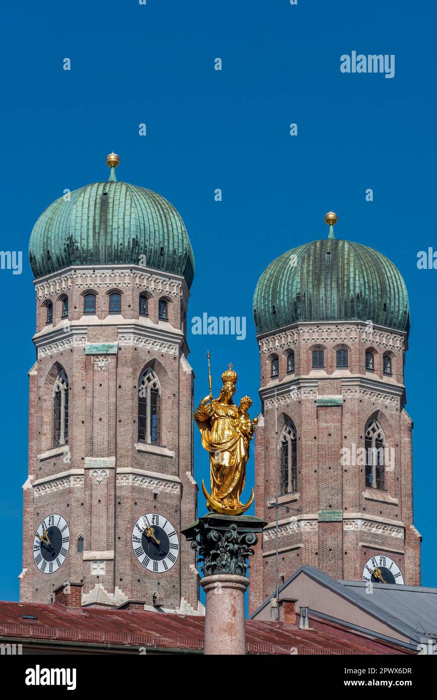 The golden statue of the Marian column on the Marienplatz in the old ...