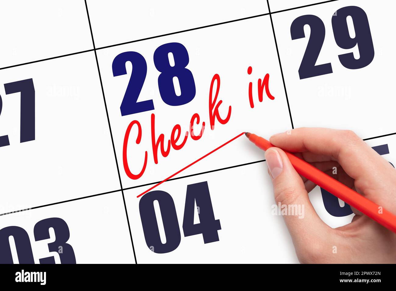 28th day of the month. Hand writing CHECK IN and drawing a line on ...