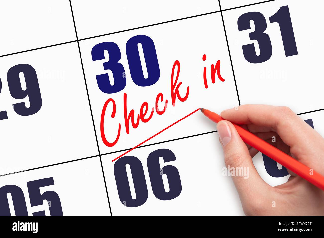 30th day of the month. Hand writing CHECK IN and drawing a line on ...