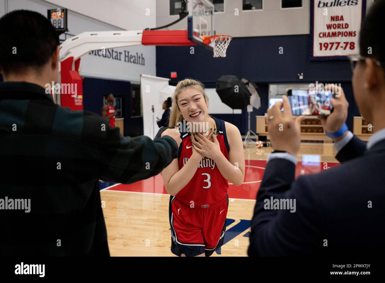 Washington Mystics guard Li Meng (3) reacts as she is interviewed ...