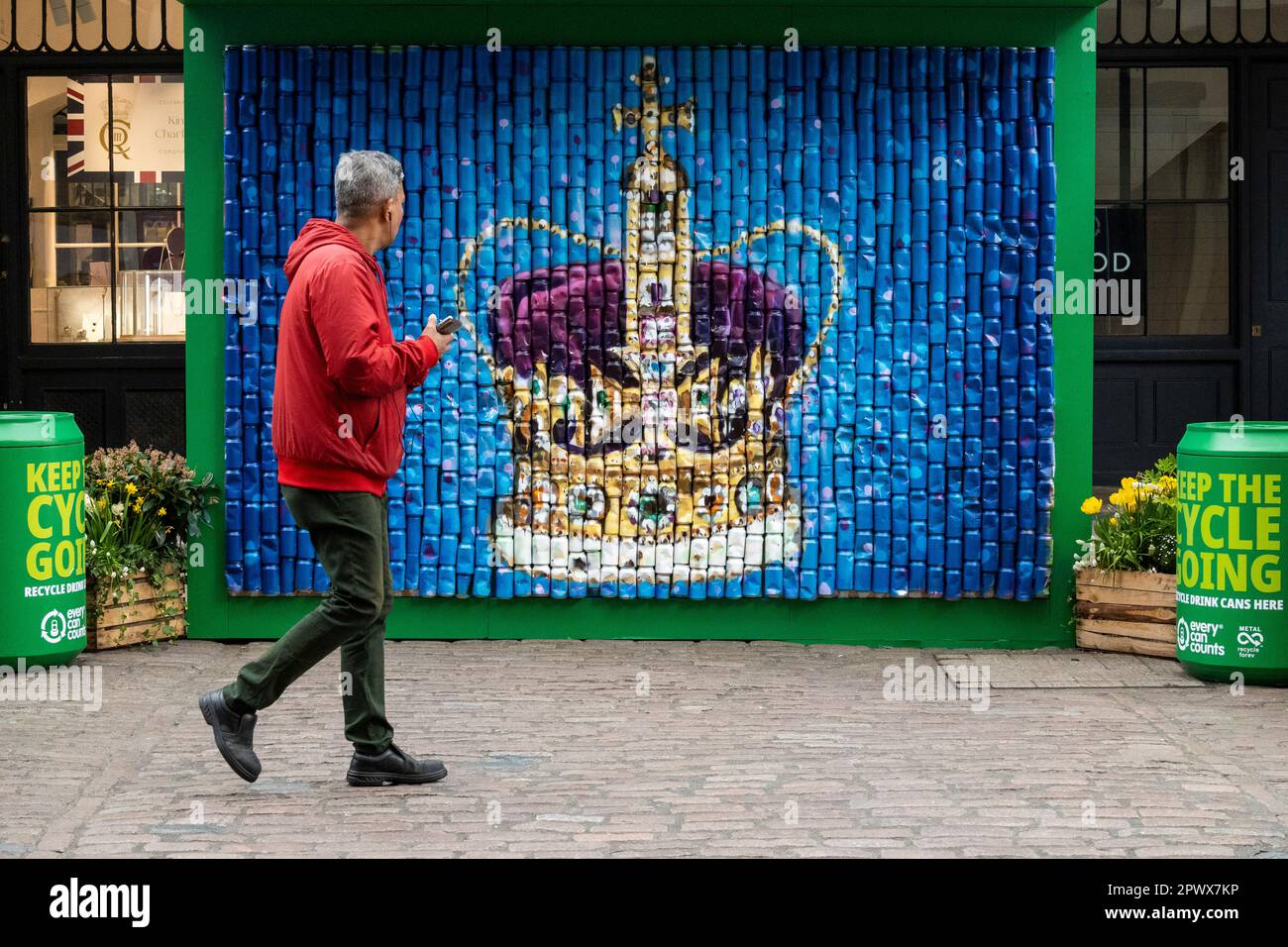 London, UK. 1 May 2023. A man passes 'CANvas' by London based artist ...