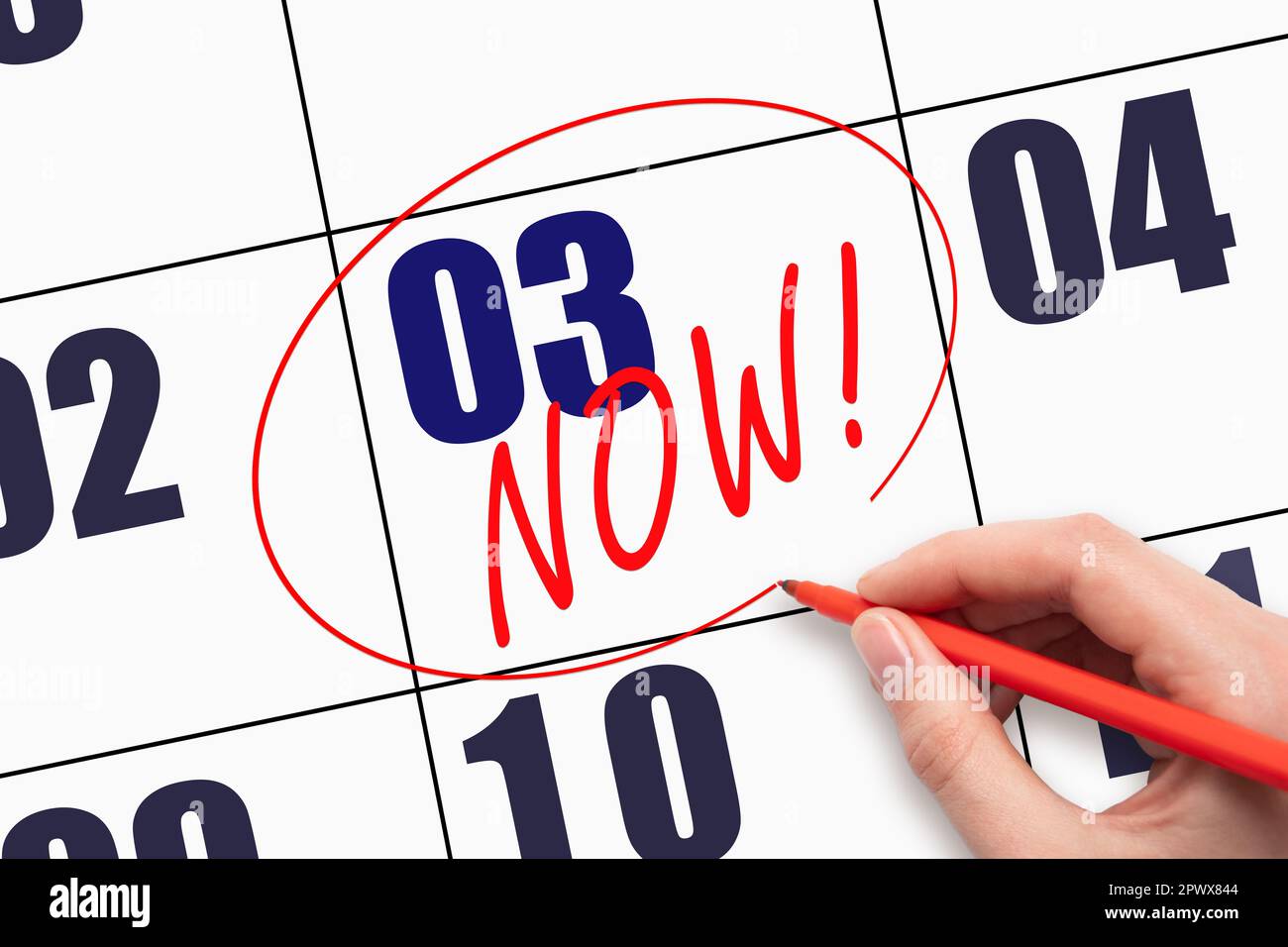 3rd day of the month. Hand writing text NOW and circling the calendar ...
