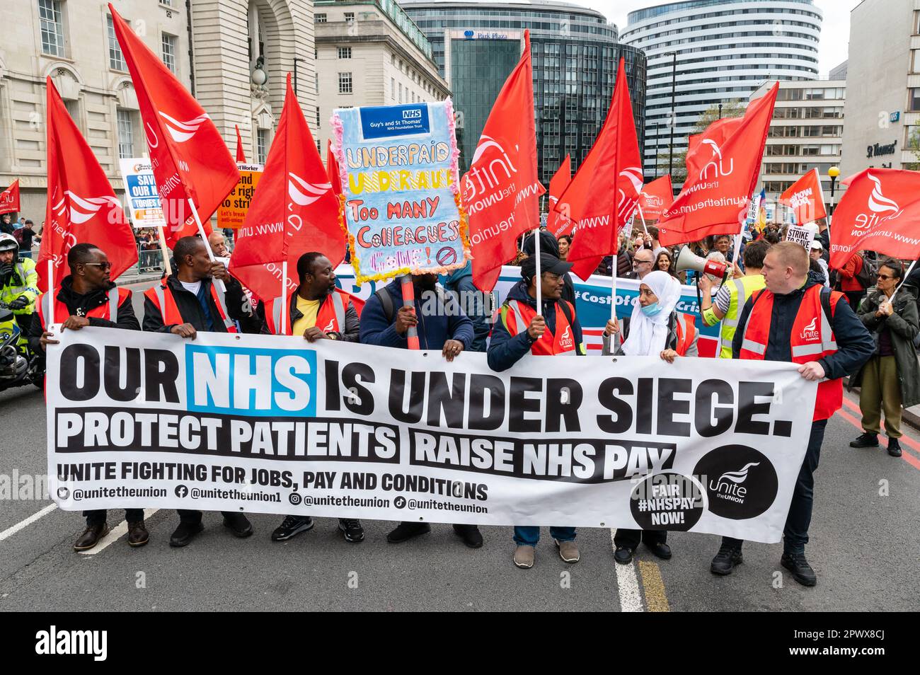 London, UK. 1 May 2023. NHS workers march from St Thomas’ Hospital to ...