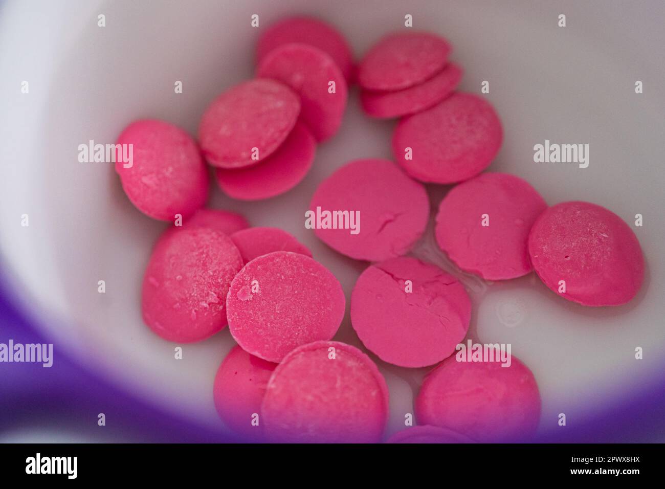 Mini pink chocolates Stock Photo - Alamy