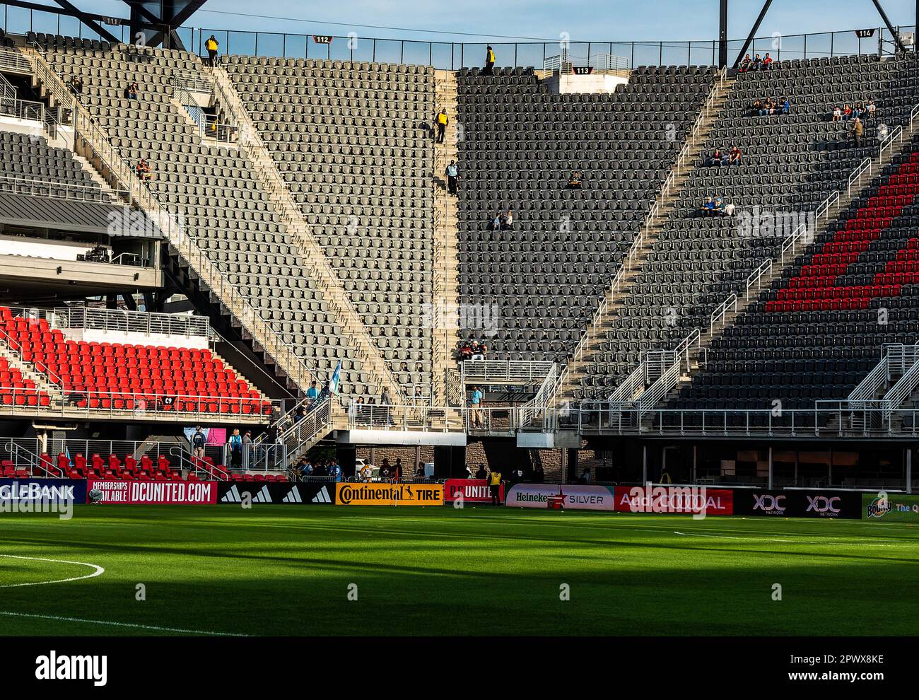 Security guard at a section of seats in a soccer stadium Stock Photo ...