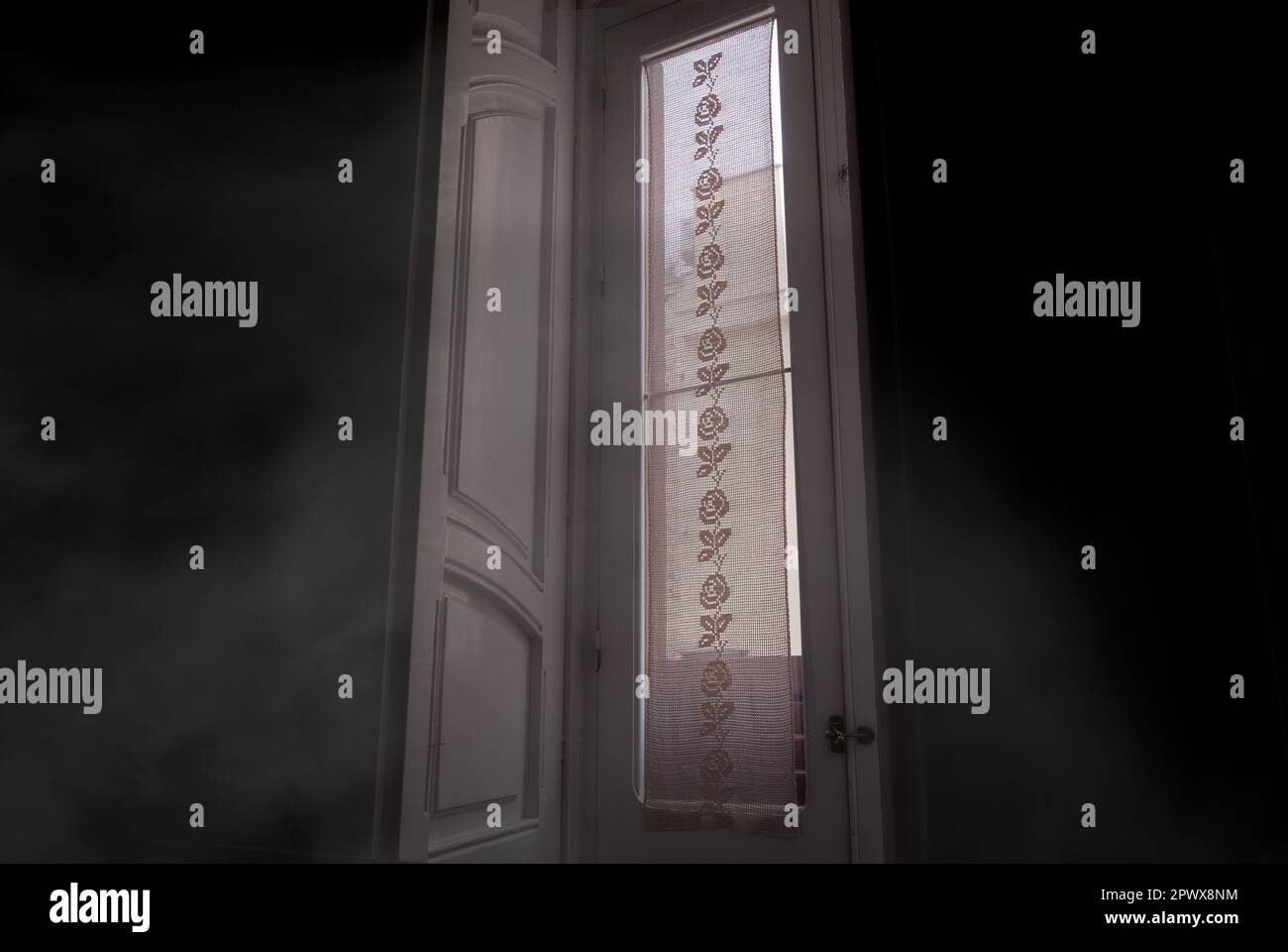 a hazy light filters into the dark room Stock Photo - Alamy