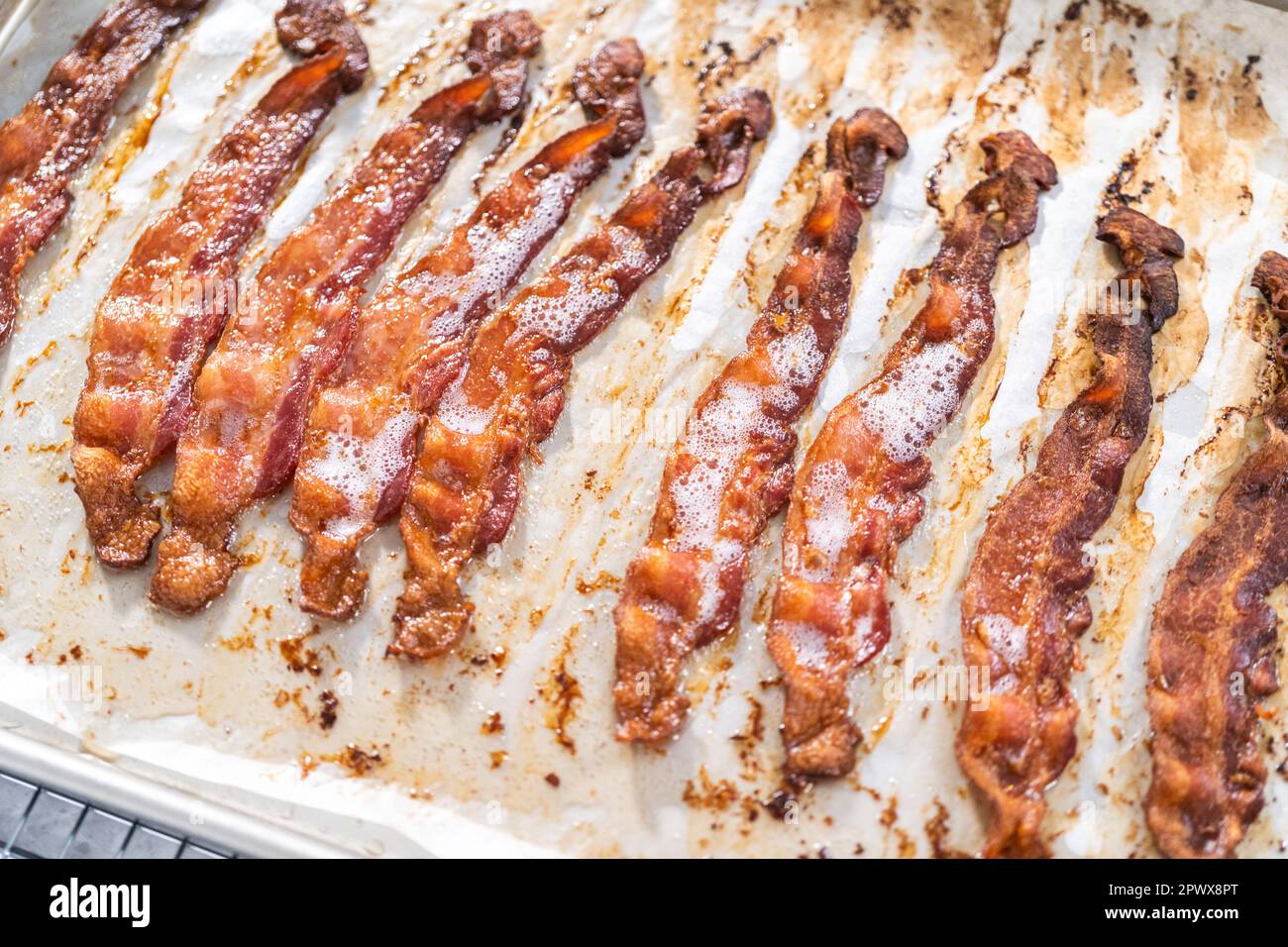 Cooking bacon strips Stock Photo - Alamy
