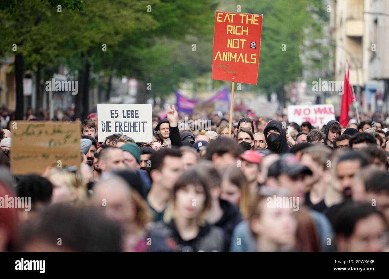 Berlin, Germany. 01st May, 2023. Demonstrators hold up posters reading ...