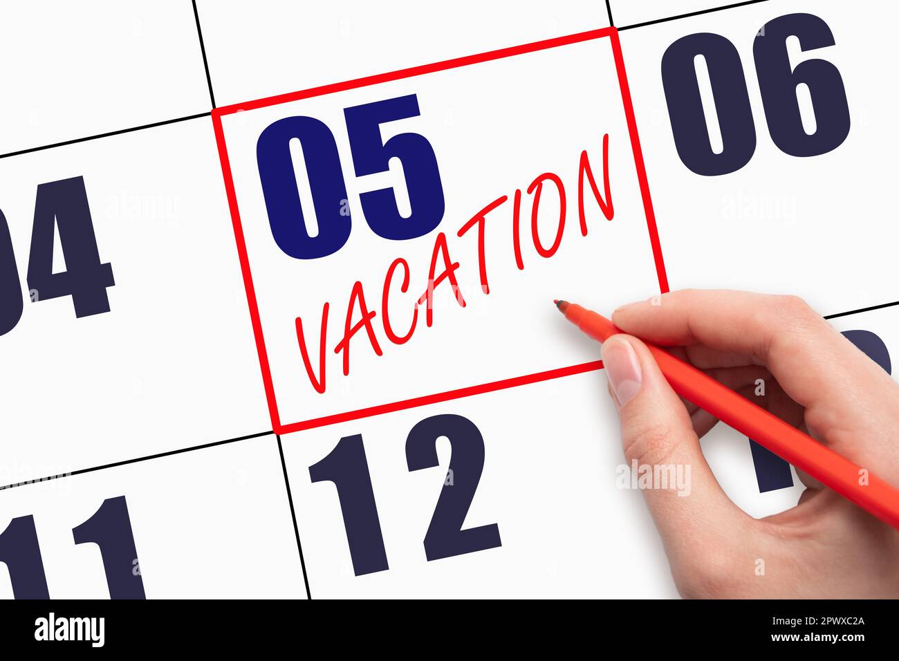 5th day of the month. Hand writing text VACATION on calendar date ...