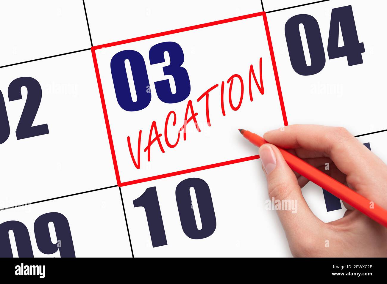 3rd day of the month. Hand writing text VACATION on calendar date ...