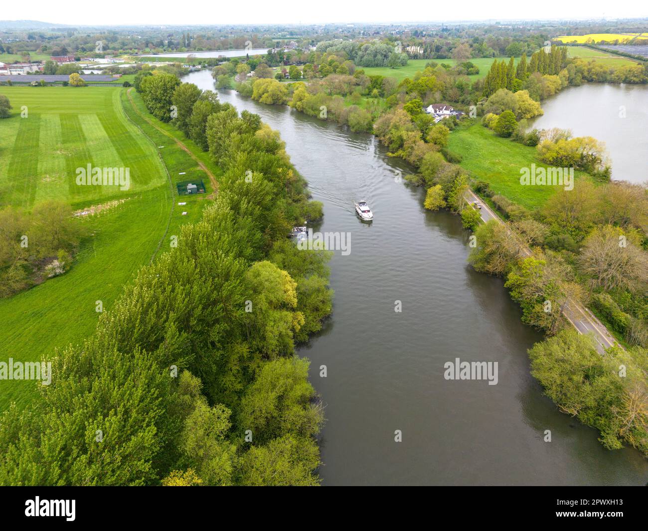 Aerial view along the River Thames near Chertsey Bridge, Chertsey ...
