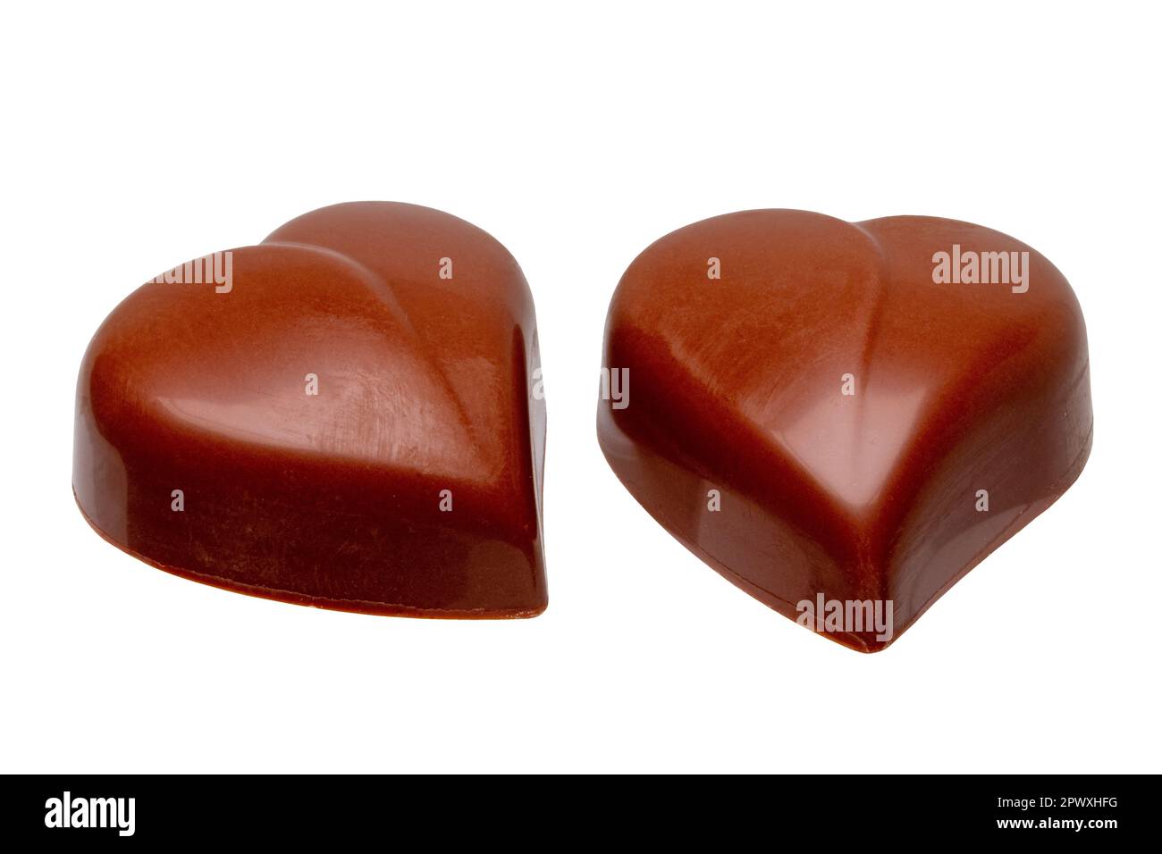 Fine milk chocolate chocolates in the shape of a heart isolated on a ...