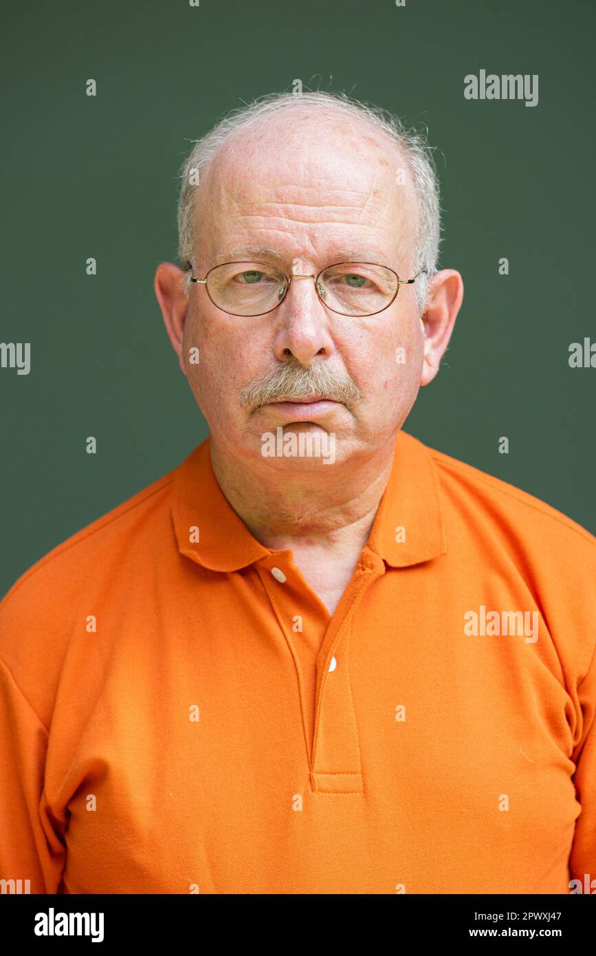Portrait Of Grey Haired Senior Man With Mustache Wearing Eyeglasses