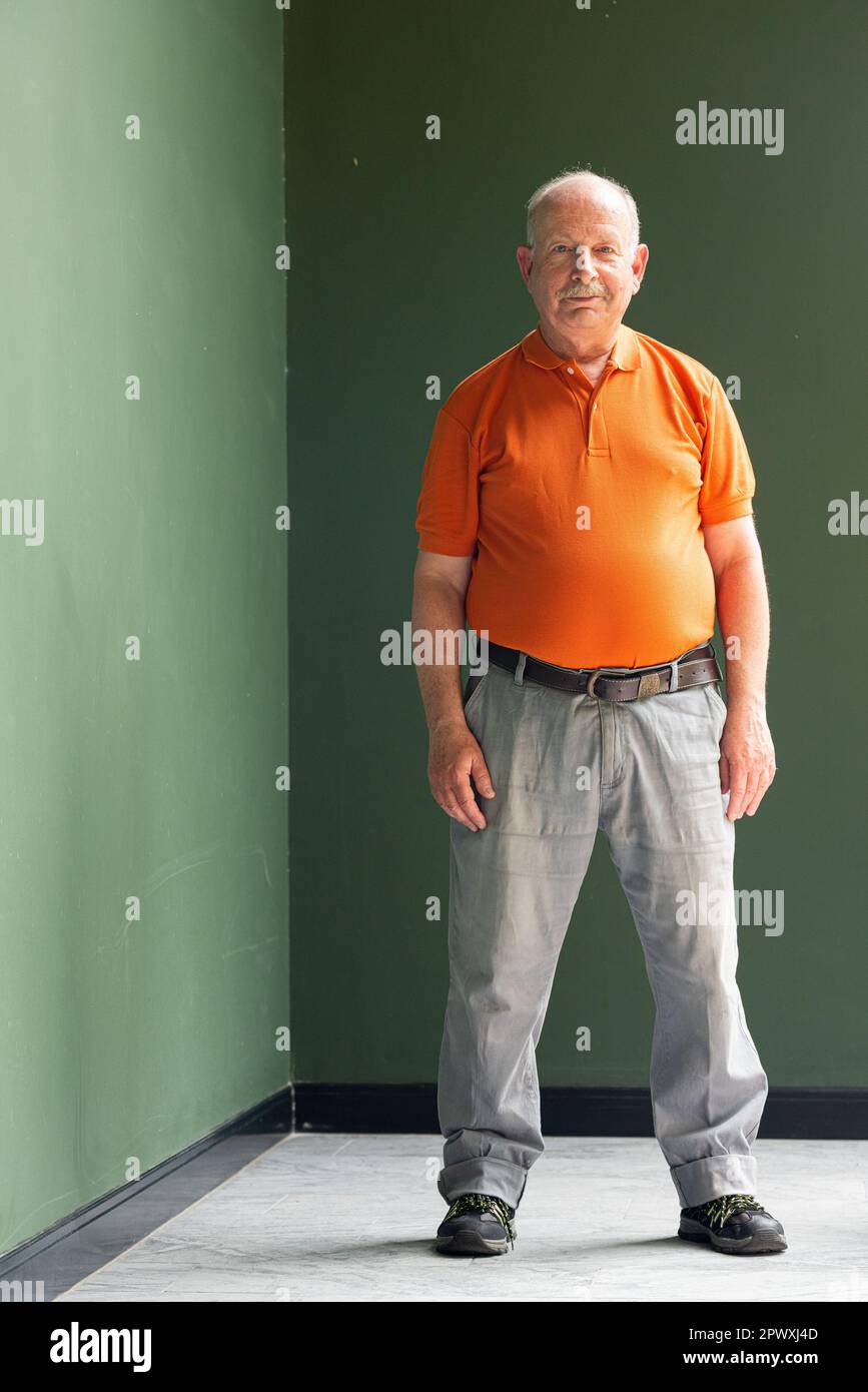 Full Length Portrait Of Grey Haired Senior Man With Mustache Wearing