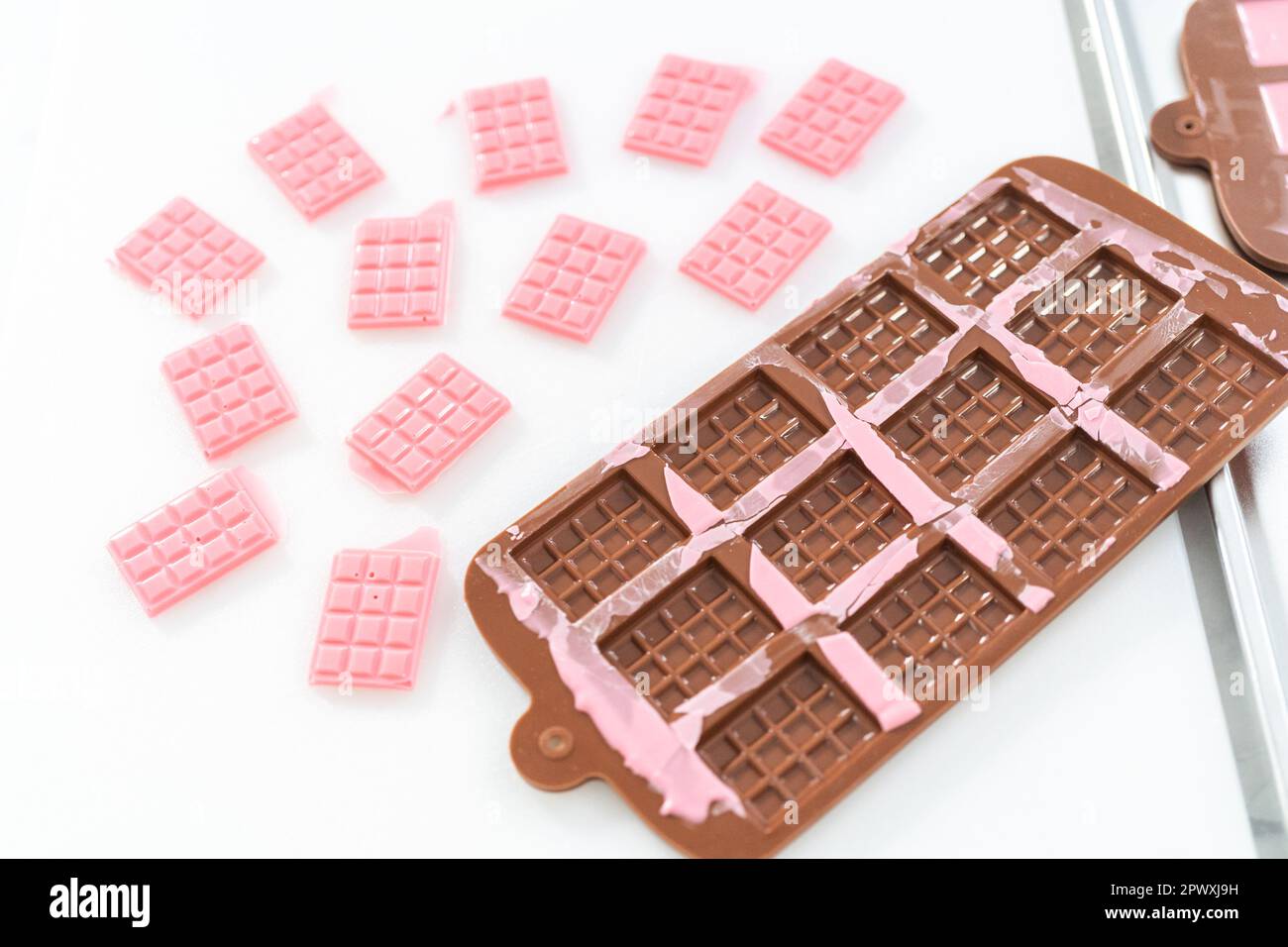 Mini pink chocolates Stock Photo - Alamy