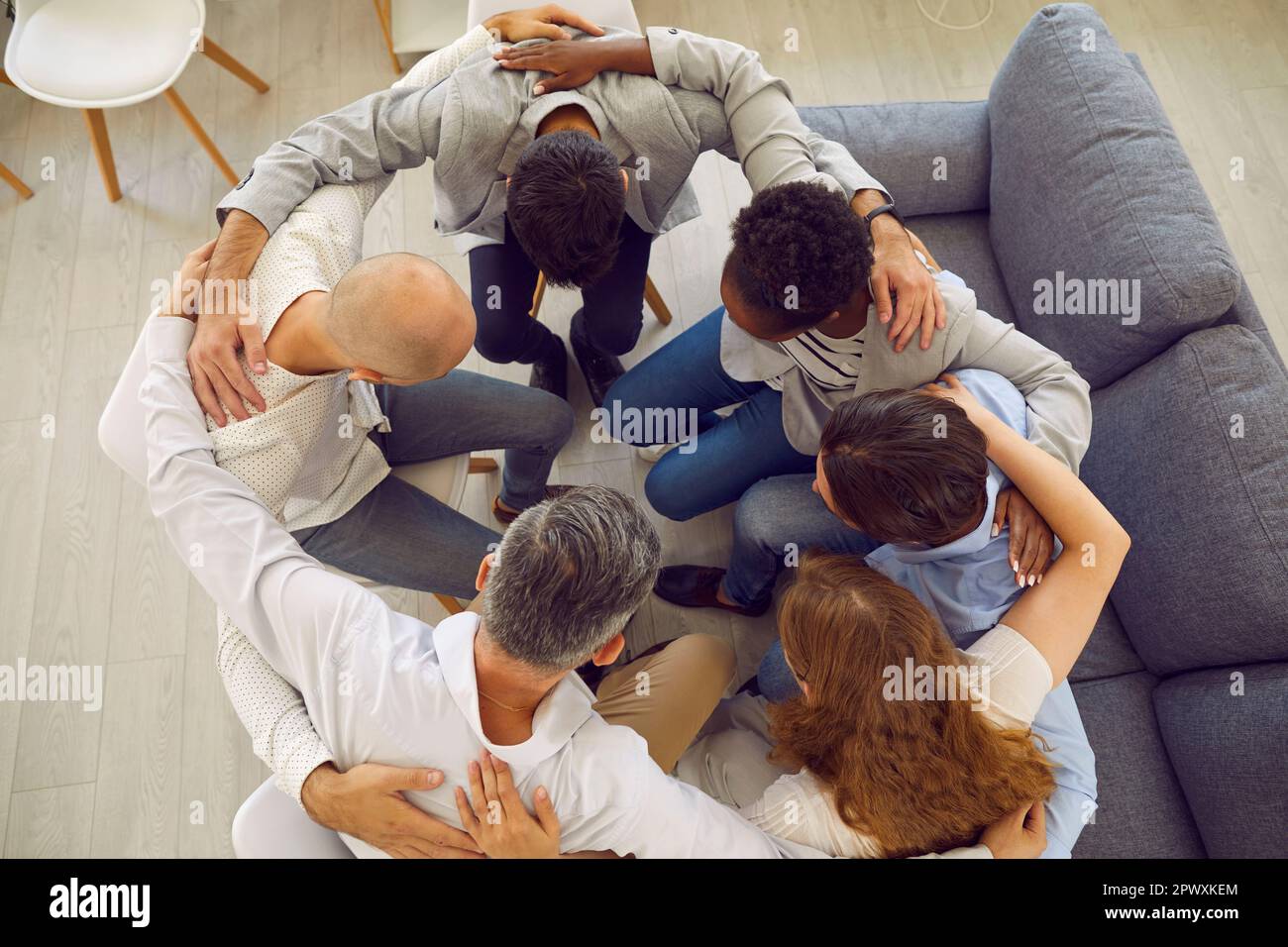 Team of diverse multiracial corporate employees and friends huddling in ...