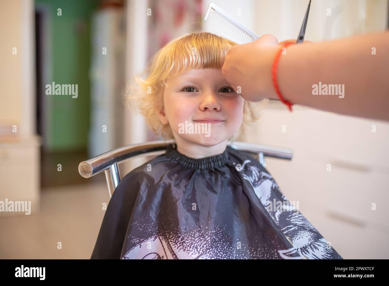 young girl gets a new haircut at a local beauty salon Stock Photo - Alamy