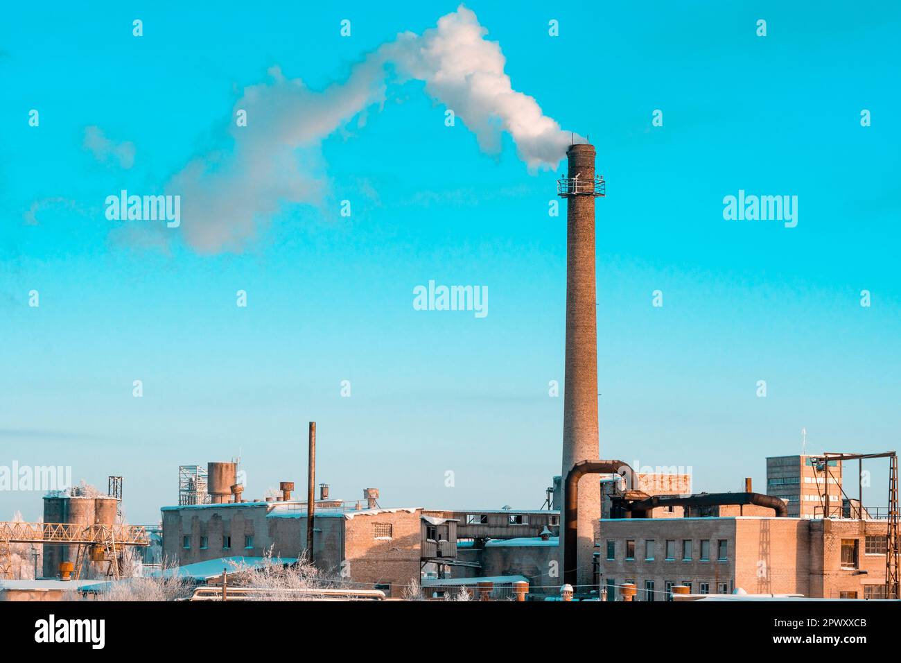 Steam pipe of the central boiler plant in a frozen winter day ...