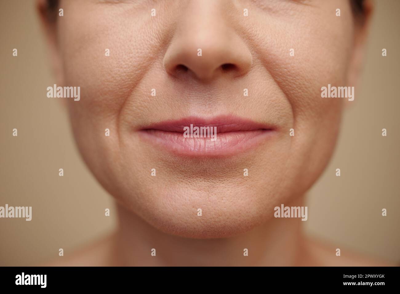 Lower face part of smiling mature woman Stock Photo - Alamy
