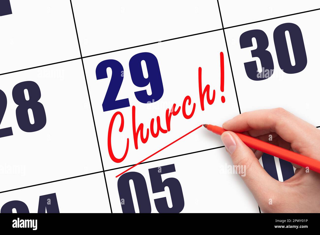 29th day of the month. Hand writing text CHURCH and drawing a line on ...