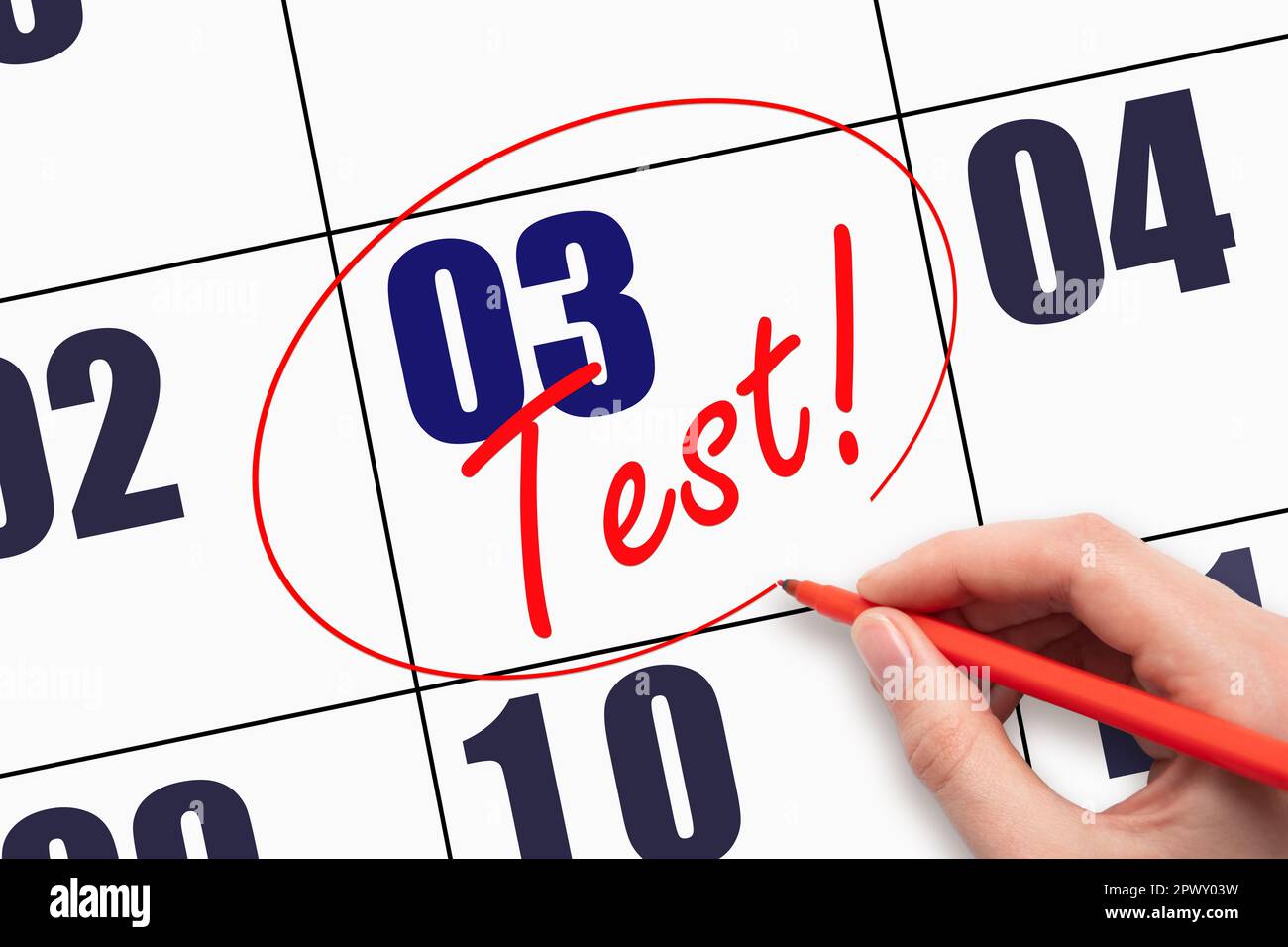 3rd day of the month. Hand writing text TEST and circling the calendar ...
