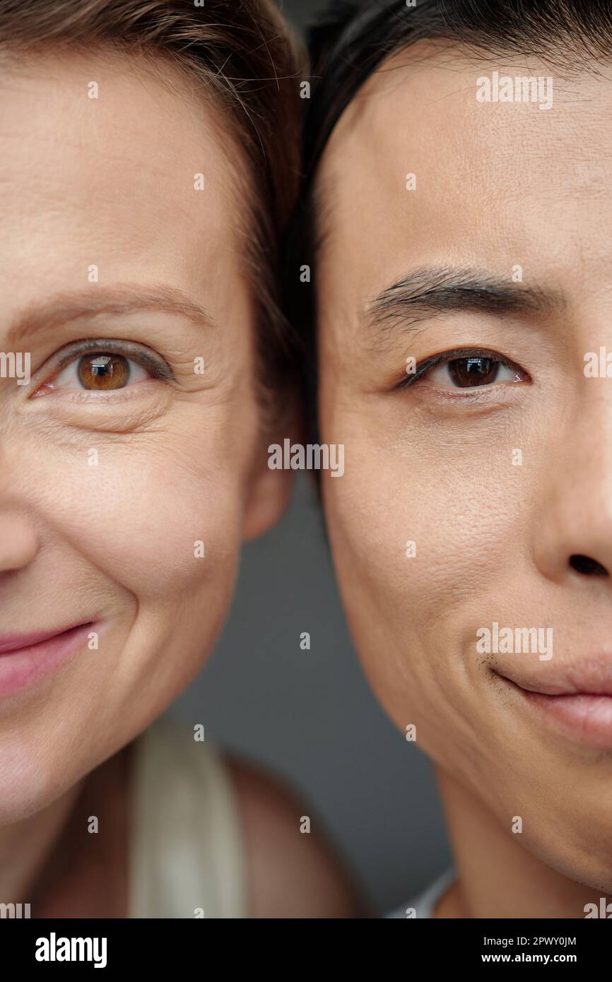 Faces of diverse couple with age difference smiling at camera Stock ...
