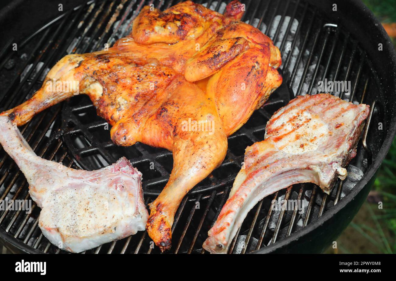 very big grilled chicken and bbq pork chop Stock Photo - Alamy