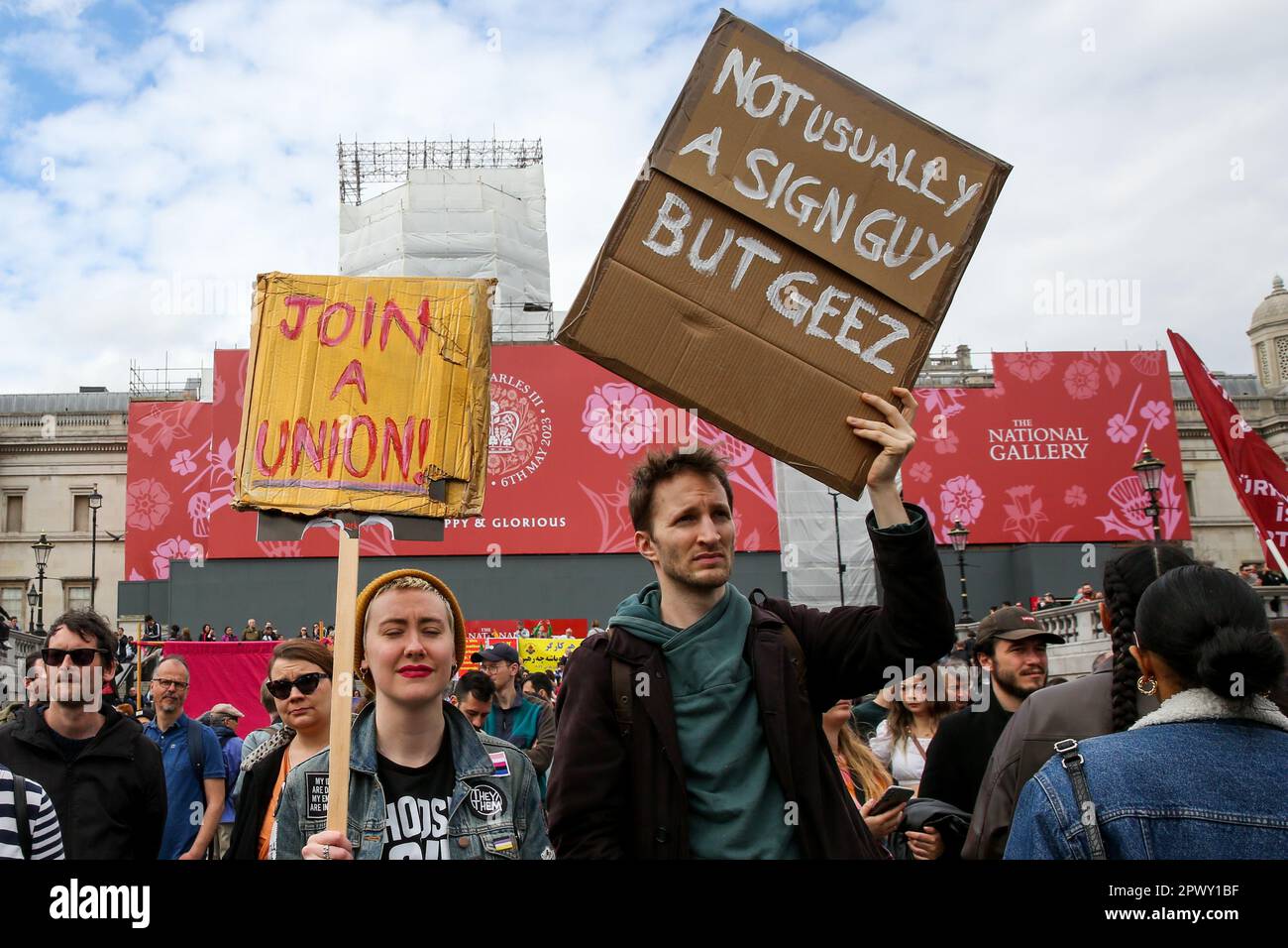 London, UK. 01st May, 2023. A couple holding placards attends the ...