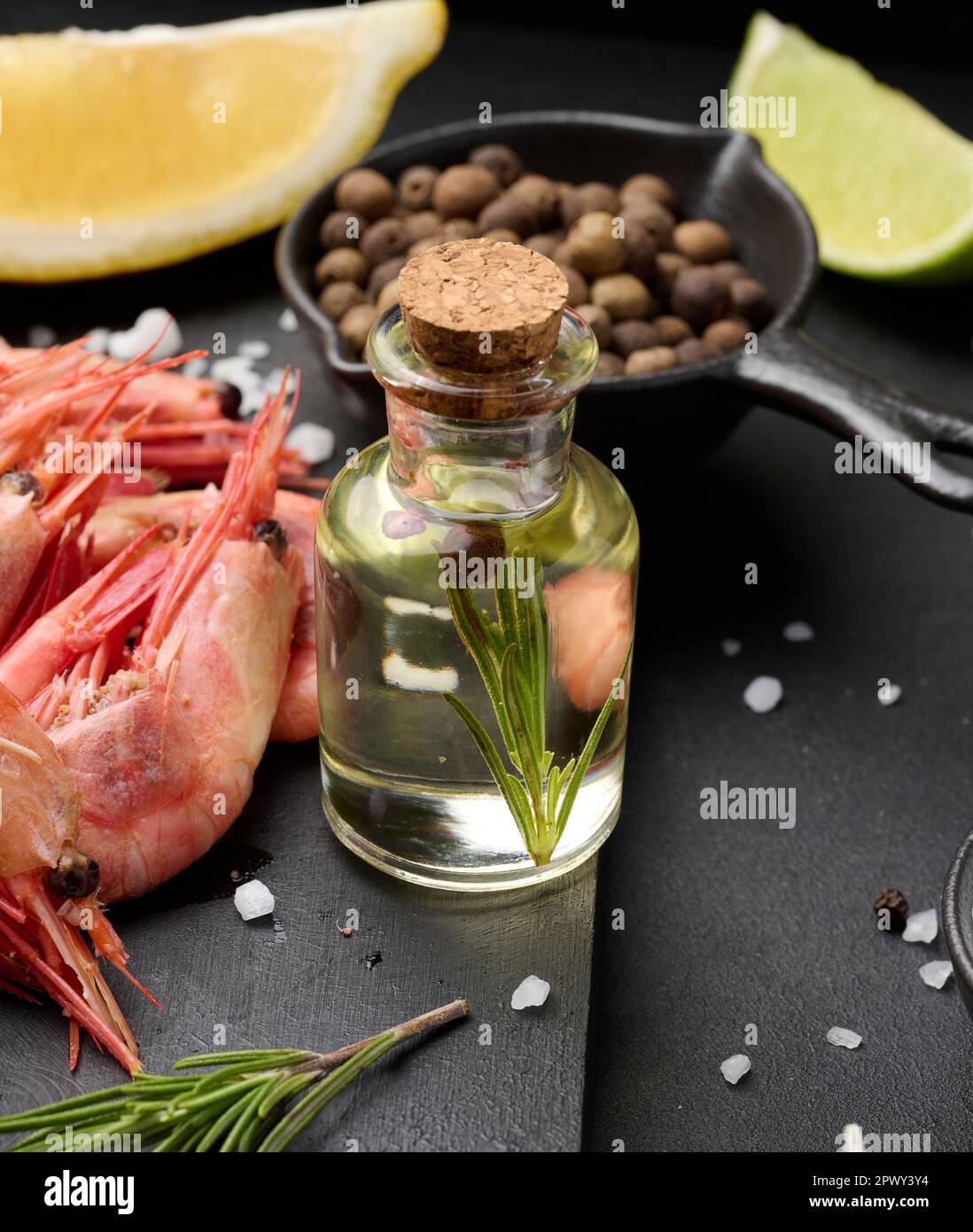 Olive oil in a glass bottle and boiled shrimp Stock Photo - Alamy