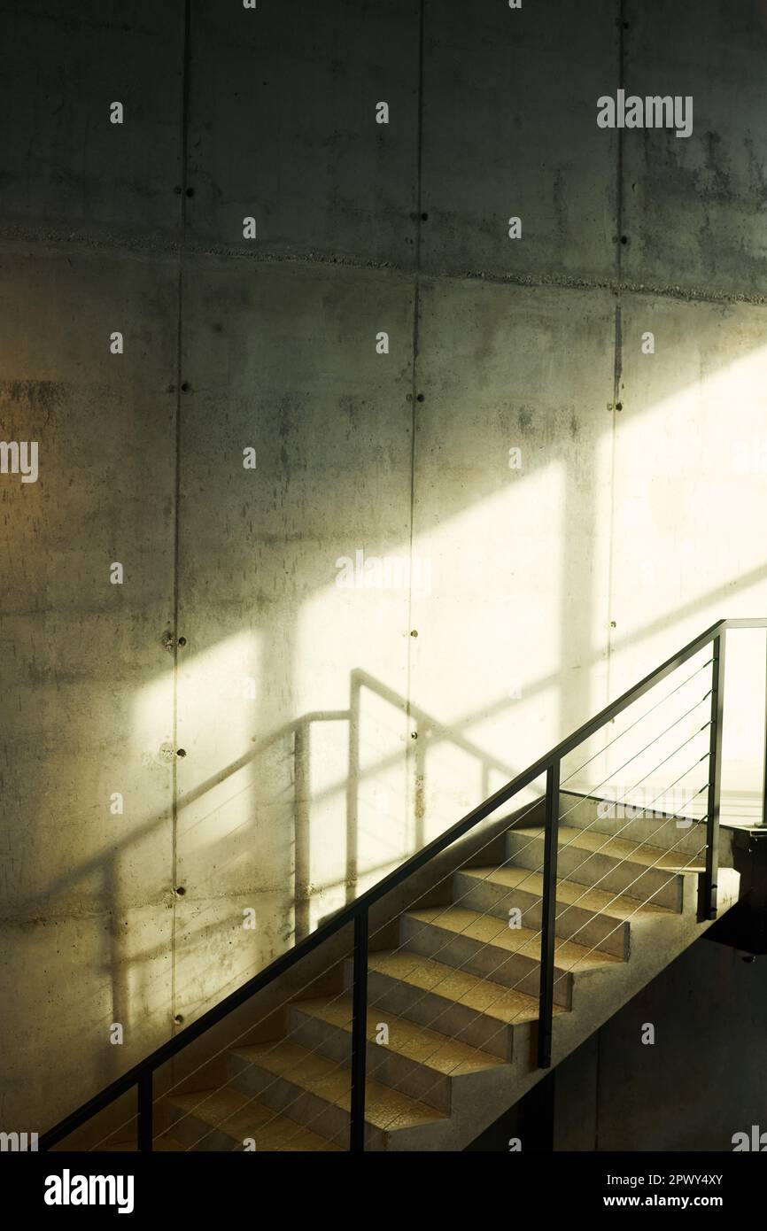 Part of poor lit interior of abandoned building with concrete slabs ...