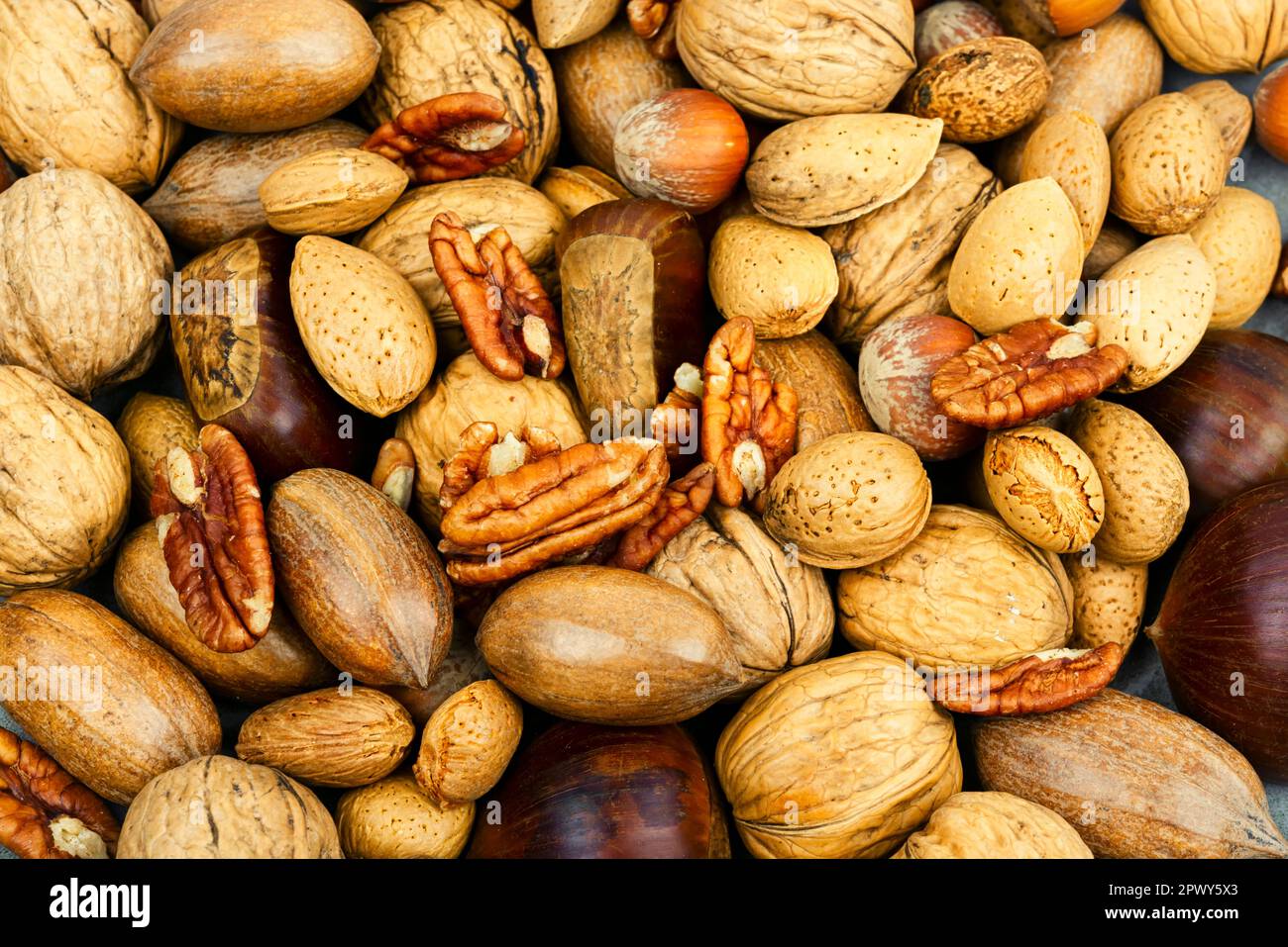 Walnut, chestnut, almond, hazelnut on the table.Healthy food and snacks ...