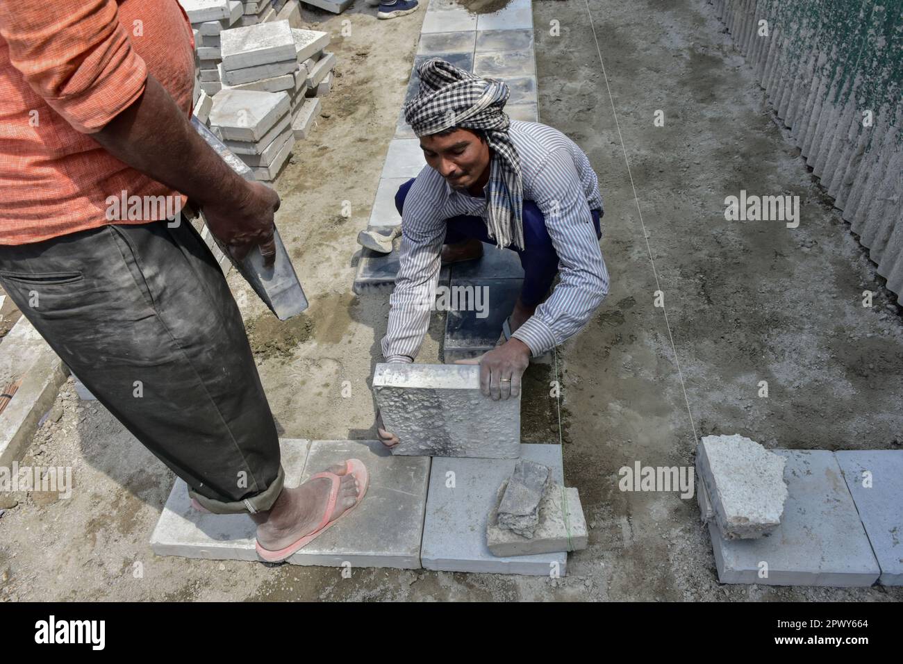 Srinagar, India. 01st May, 2023. Labourers work at a construction ...