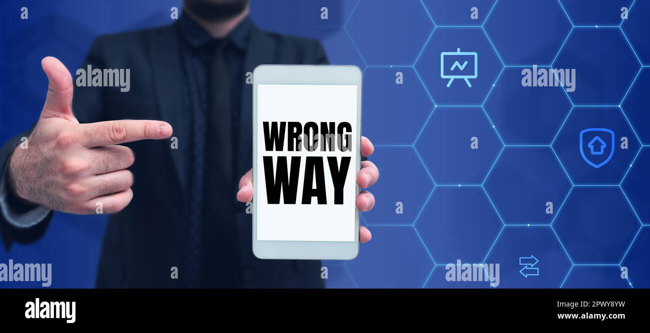 Hand writing sign Wrong Way, Concept meaning taking an unsuitable or ...