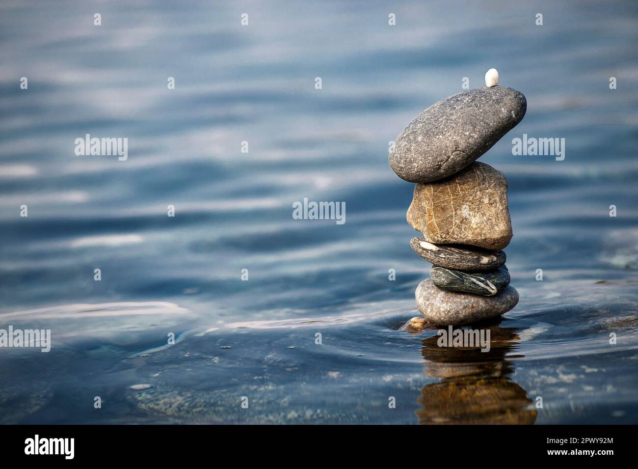 balanced stones on the rocks of the sea Stock Photo - Alamy